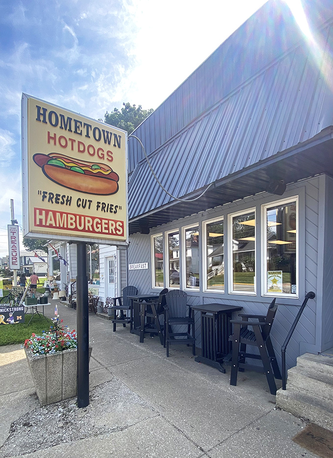 Sun glints off Hometown Hot Dogs' classic sign, a beacon of fresh-cut fries and perfectly grilled franks in small-town Millersport.