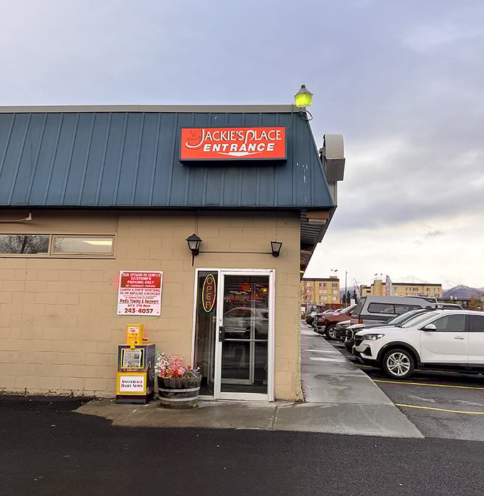 That bright red "ENTRANCE" sign isn't just directions &ndash; it's your gateway to some of Anchorage's most satisfying comfort food at Jackie's Place.
