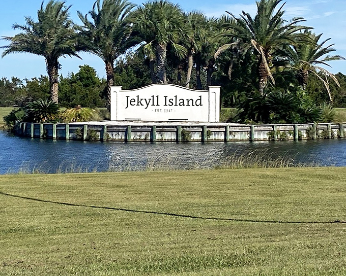 Welcome to Jekyll Island, where palm trees sway in coastal breezes. This historic entrance sign greets visitors to Georgia's barrier island gem.