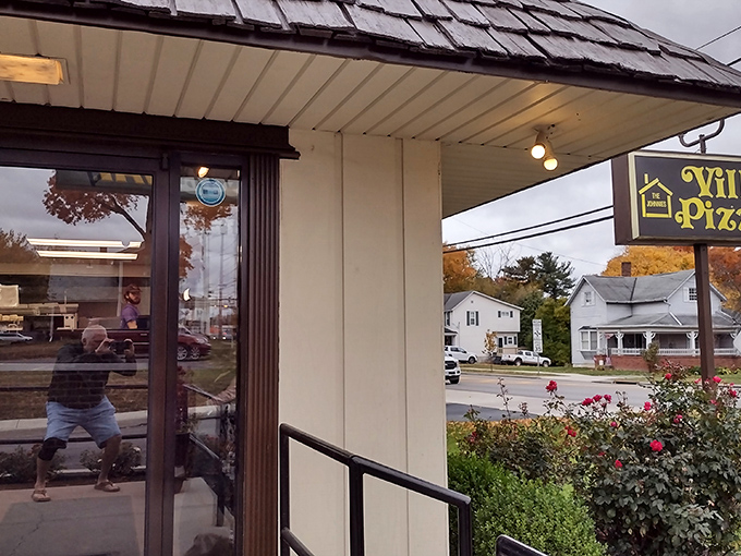 Fall colors complement the cozy entrance of Johnnies Villa Pizza, where comfort food meets artisanal craftsmanship.