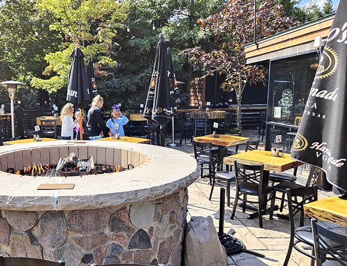 That inviting outdoor patio with the stone fire pit makes every steak dinner feel like a special backyard celebration.