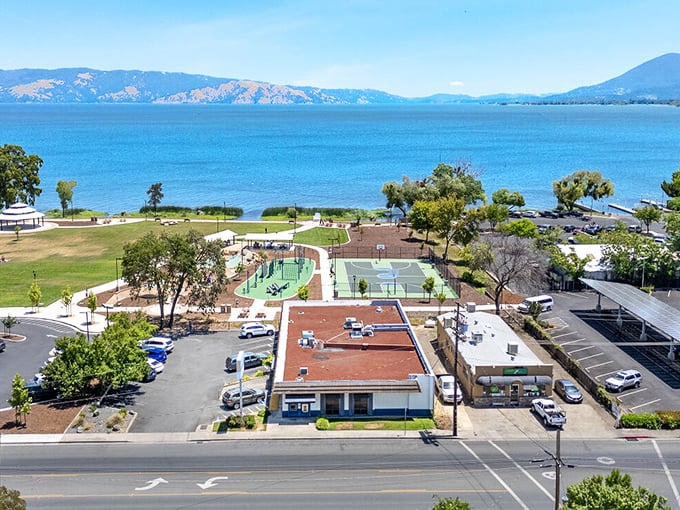 Clear Lake's sparkling waters frame Lakeport's community spaces. Tennis courts and parks offer recreation with million-dollar views at budget-friendly prices.