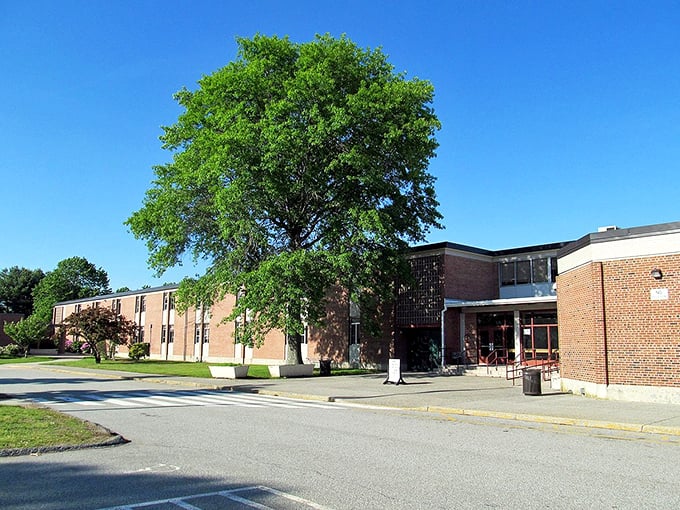 Colonial elegance against blue Connecticut skies – this historic white building has weathered centuries with dignified grace.