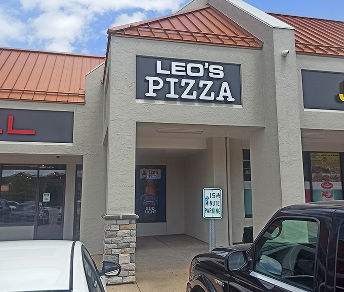 No frills, just skills at Leo's Pizza. The 15-minute parking sign suggests they know you'll be back&mdash;and soon!