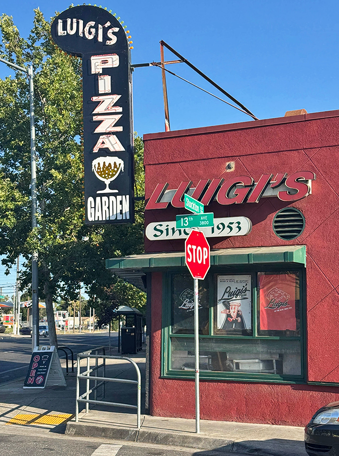 Luigi's vintage sign glows against the California sky, promising pizza traditions that have stood the test of time since 1953.