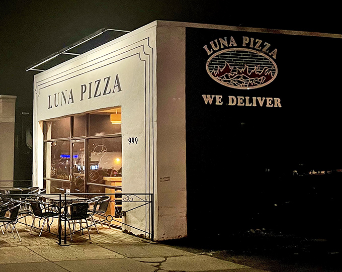 Luna Pizza glows like its namesake after dark. That "We Deliver" sign might be the three most beautiful words in the English language.