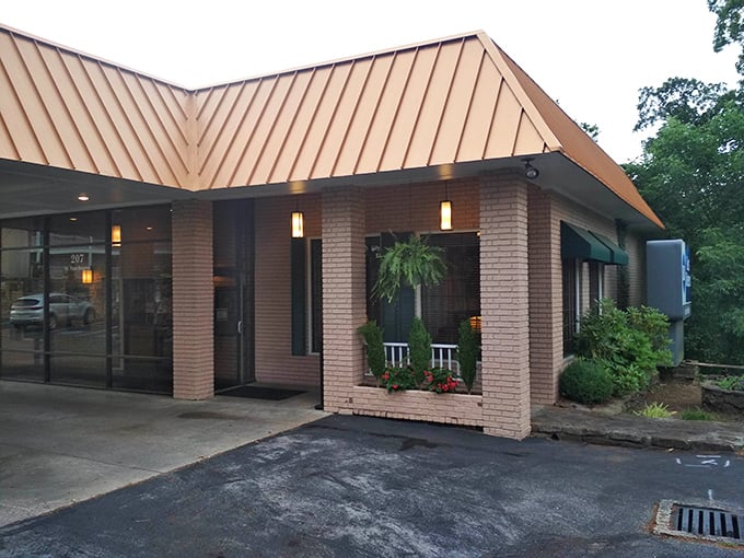 The warm brick exterior of Myrtie Mae's hints at the golden, crispy treasures waiting just beyond those doors.