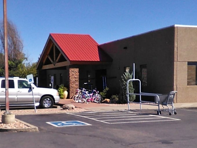 New Horizons' rustic exterior with red-roofed entrance invites explorers. Even the bicycles outside are looking for new adventures!