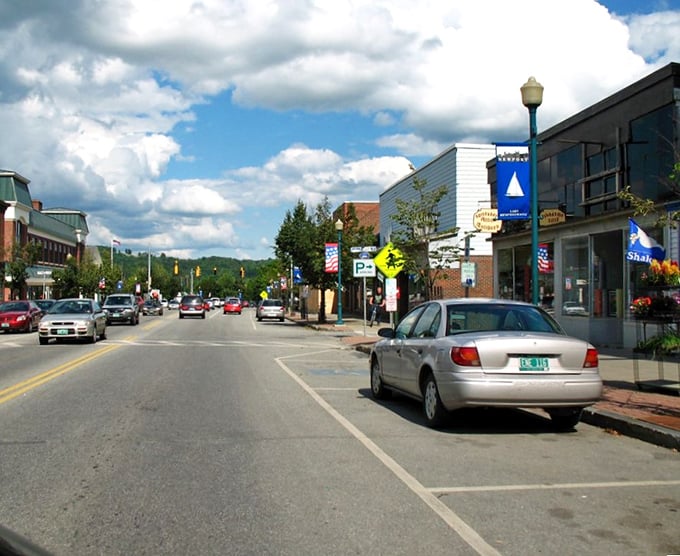 Main Street Newport basks under Vermont's blue skies, offering affordable small-town charm with Lake Memphremagog's beauty just steps away.
