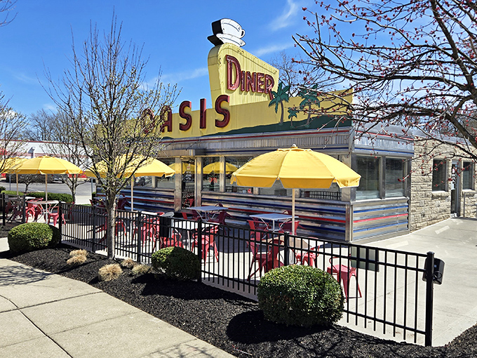 Sunny yellow umbrellas dot the patio at Oasis Diner. The perfect spot to enjoy a stack of pancakes while admiring that gorgeous stainless steel exterior.