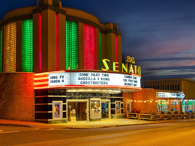 The Senator Theatre glows like a time machine at dusk, ready to transport you back to when movies were events.