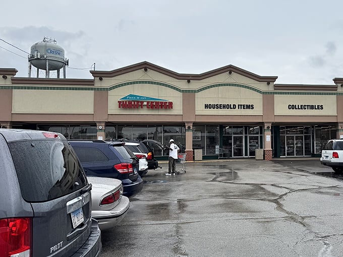 Rain or shine, Pass It On Thrift Center's "Household Items" and "Collectibles" signs promise organized treasure hunting.