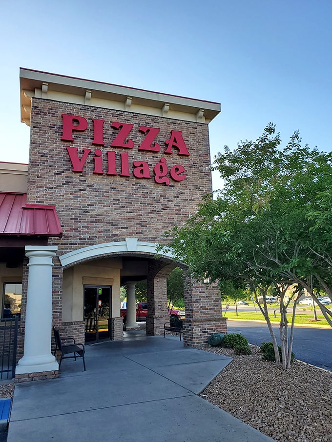 The kind of place where the sign alone makes your mouth water, promising pizza perfection inside.