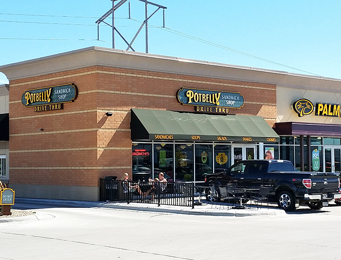 The brick facade of Potbelly houses sandwich artistry that turns lunch into an event. Their outdoor seating area practically begs for a sunny day.