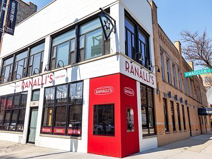 The bright red entrance pops against the brick building &ndash; as bold as the flavors waiting inside.