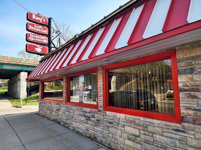 The bold red and white awning at Ray's Diner signals breakfast serious business. Like a lighthouse for the hungry, it guides morning travelers to eggy shores.