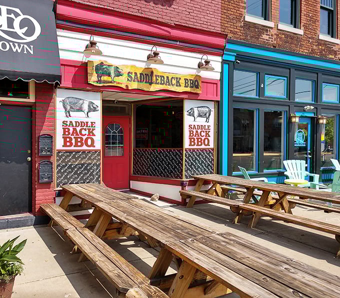 Picnic tables standing at attention outside Saddleback BBQ &ndash; silent witnesses to countless sauce-stained shirts and satisfied smiles.