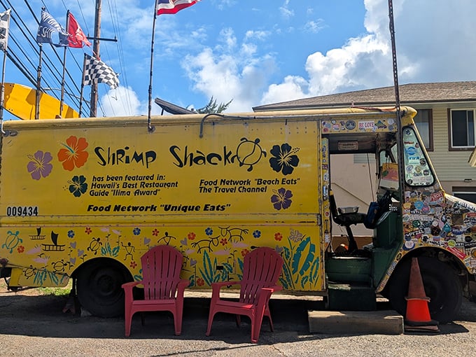 Food Network famous but keeping it real! This sunshine-yellow shrimp haven with Adirondack seating proves paradise needs no pretension.