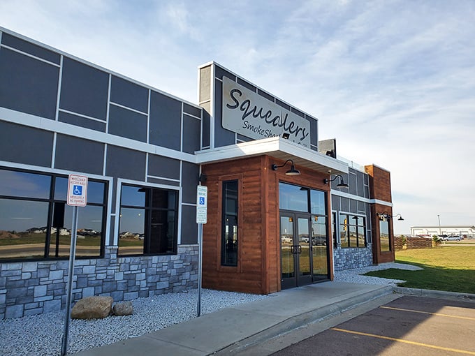 Stone and wood accents hint at the rustic flavors waiting inside this contemporary temple of smoked meats.