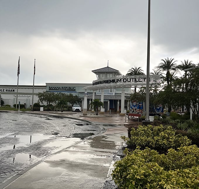 Shopping nirvana under stormy skies. Tampa Premium's entrance stands ready for bargain hunters who laugh in the face of rain.