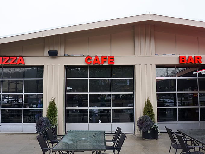 Three words in bright red letters tell you everything you need to know about this unpretentious pizza paradise.