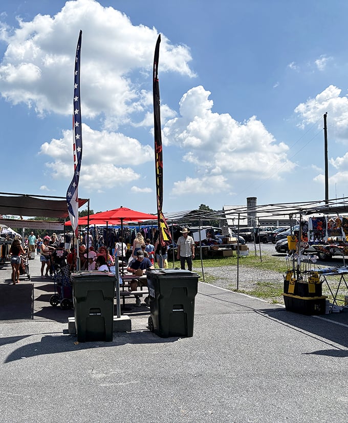 Tall flags wave like market beacons under Pennsylvania blue skies, guiding shoppers to the next great bargain.