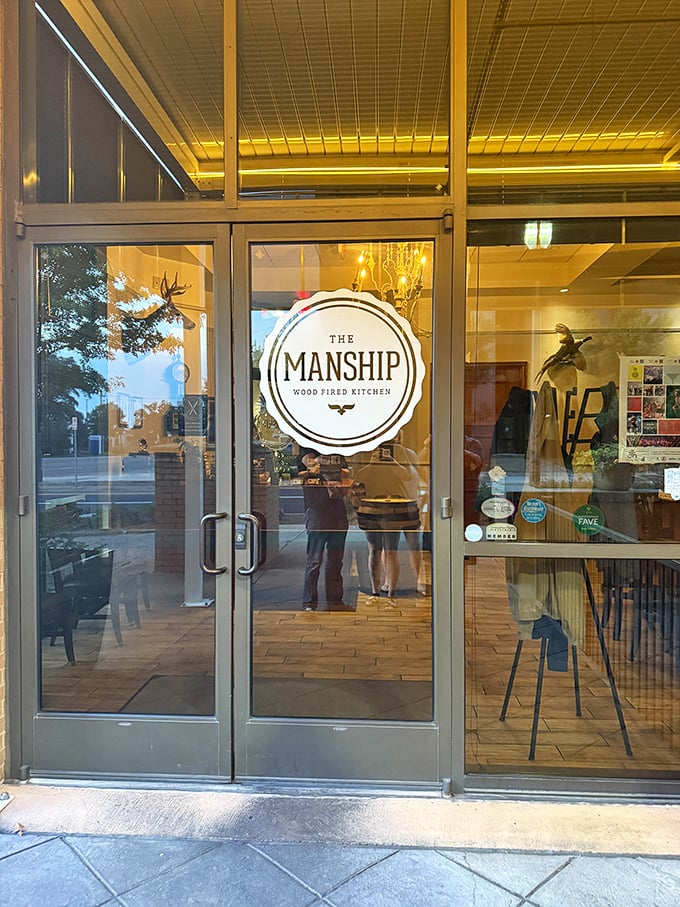 The Manship's elegant entrance promises a refined pizza experience. Where fire meets flour in a delicious dance!