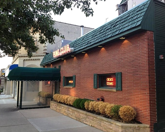 Brick facade, green awning, timeless reputation. The Pine Club doesn't need to shout about its steaks&mdash;they speak for themselves.
