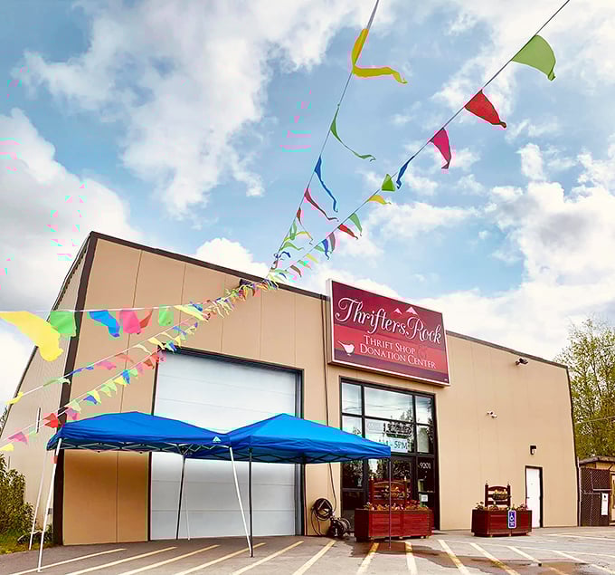 Festival flags flutter above Thrifters Rock, celebrating the joy of finding someone else's castoffs that become your treasures.