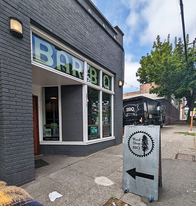 Urban meets rustic at Wood Shop BBQ. That sign isn't just pointing the way &ndash; it's directing you to flavor town!