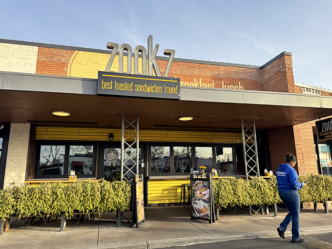 Morning light bathes Zookz's inviting storefront, where circular sandwich perfection awaits the hungry and curious alike.