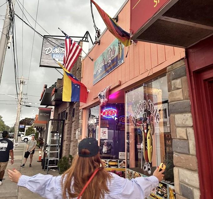 Those colorful banners fluttering in the ocean breeze practically beg you to grab a dog and stay awhile.