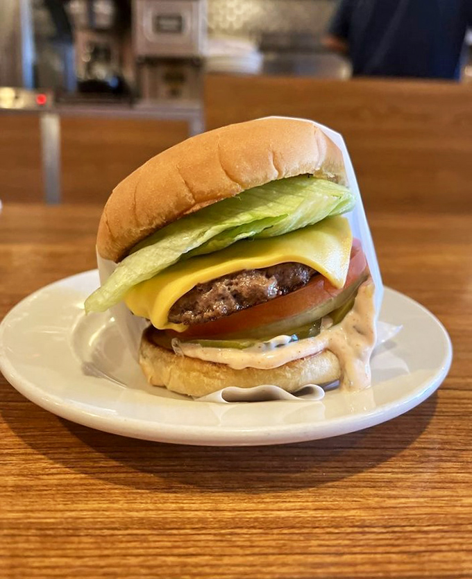 Behold, the burger in all its unpretentious glory. No brioche, no aioli, no foodie buzzwords&mdash;just beef, cheese, fresh vegetables, and that special sauce.