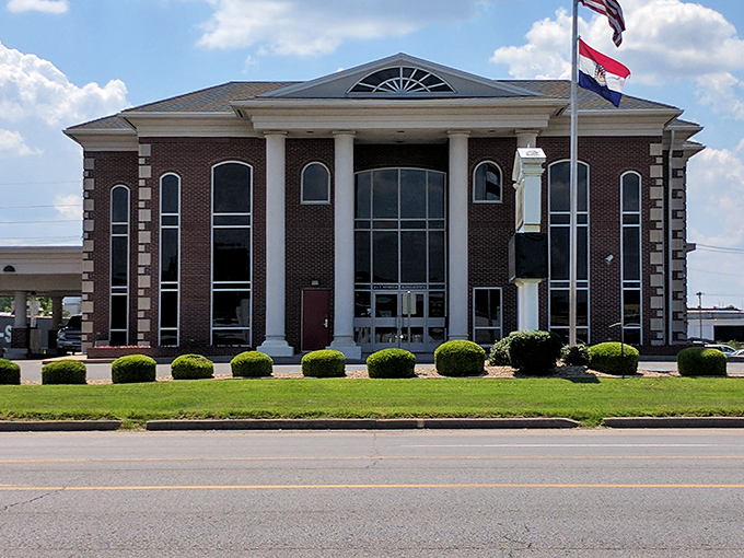 Alliance Bank's stately columns and brick facade bring a touch of Southern grandeur to this riverside Missouri gem.