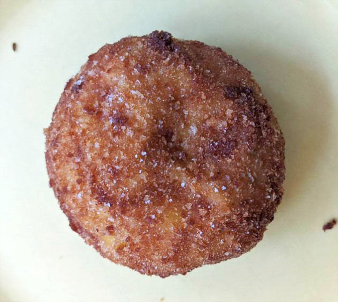 Golden-fried perfection that Sicilian grandmothers would approve of. This arancini ball promises a crispy exterior giving way to creamy, savory bliss inside.