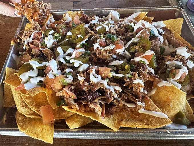 BBQ nachos: where tortilla chips fulfill their highest purpose by becoming vehicles for smoky pulled meat and tangy jalape&ntilde;os.
