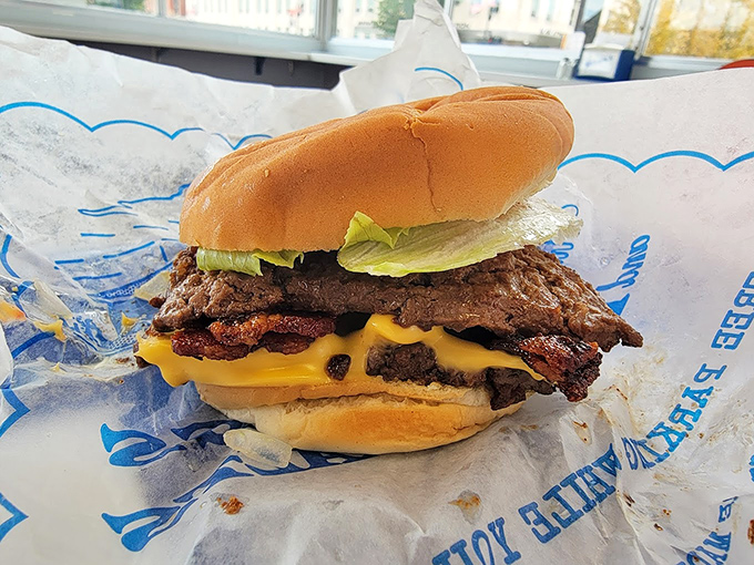 Behold the burger in all its glory&mdash;melted cheese cascading over the patty like a yellow waterfall of deliciousness.