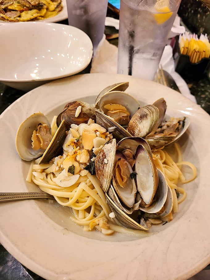 These clams aren't just opened, they're having a party with linguine. The kind of dish that makes you consider learning Italian just to properly express your gratitude.
