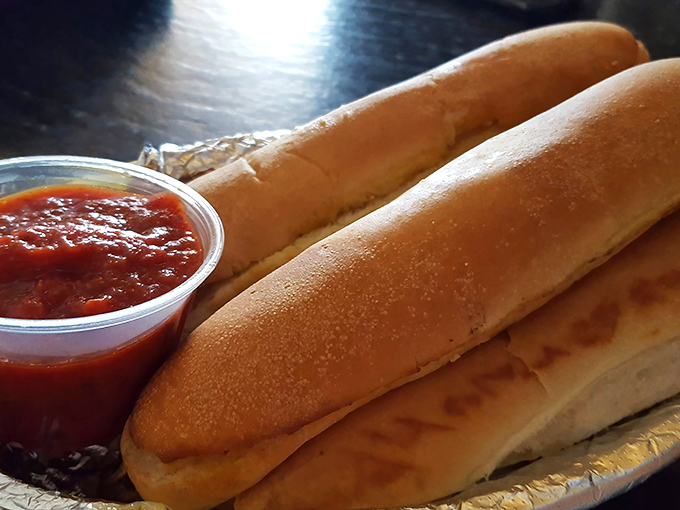 These aren't just breadsticks&mdash;they're the opening act to pizza perfection. Golden-brown, pillowy inside, and ready for their marinara sauce bath.