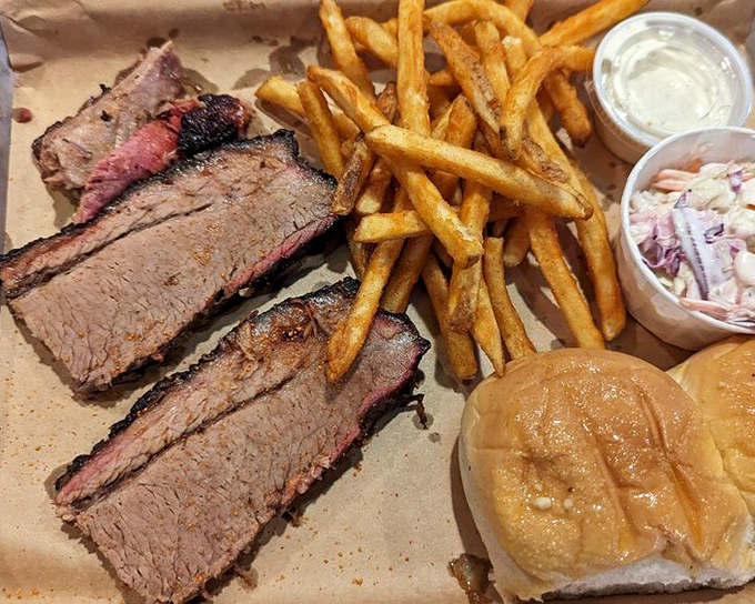 Brisket with that telltale pink smoke ring is barbecue's holy grail. This plate doesn't just meet expectations &ndash; it's what BBQ dreams are made of.
