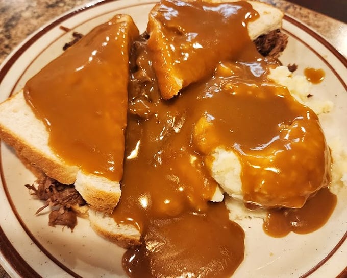 Hot beef sandwich: where bread becomes merely a vessel for gravy delivery. This isn't just comfort food&mdash;it's a warm hug on a plate after a long day.