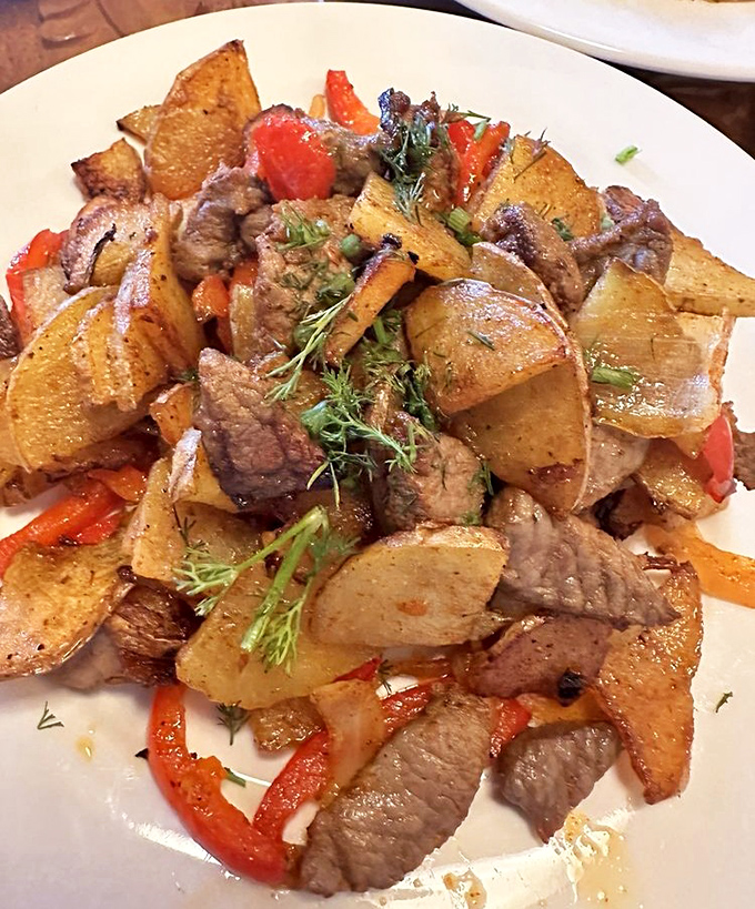 Beef stroganoff reimagined with Central Asian flair—tender meat and golden potatoes dancing together in a dish that screams "comfort" in multiple languages.