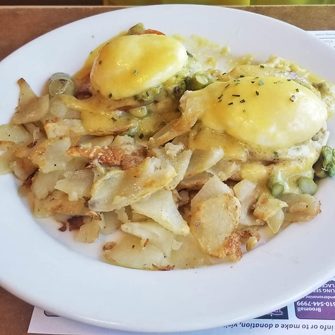 Eggs Benedict done right&mdash;perfectly poached eggs perched atop crispy potatoes, draped in hollandaise that's rich enough to make a cardiologist nervous.