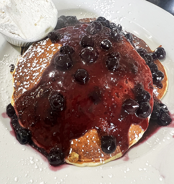 These blueberry pancakes aren't just breakfast—they're an edible work of art. The berry compote practically demands its own museum exhibition.