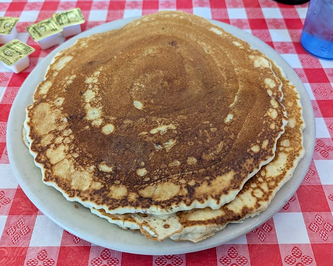 These pancakes aren't just golden brown&mdash;they're the color of childhood memories, with edges crisp enough to make you pause before drowning them in syrup.
