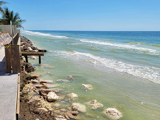 The Gulf's gentle waves provide nature's soundtrack along Boca Grande's rocky shoreline. Perfect for contemplative walks and shell-hunting expeditions.