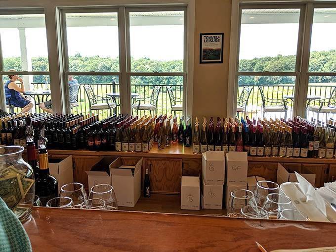 Wine bottles standing at attention like colorful soldiers, each one guarding flavors that tell the story of Pennsylvania's fertile soil and changing seasons.