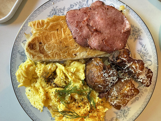 Breakfast of champions, Miami-style. When scrambled eggs, ham, and potatoes come together like this, mornings become something to celebrate.