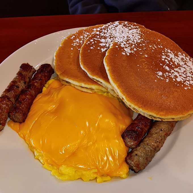 Pancakes and sausage with melted cheese&mdash;proof that breakfast is the meal most likely to make you contemplate moving next door.