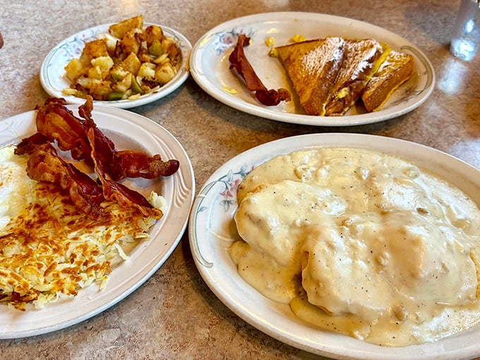 Breakfast nirvana on four plates &ndash; where biscuits and gravy aren't just a side dish, they're practically a religious experience.